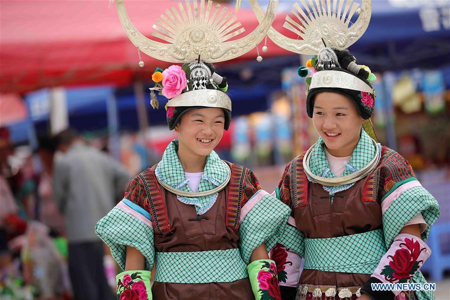 Miao ethnic group attend slope-climbing festival(1/4)