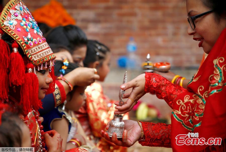 Young Nepali girls dress up as living goddess for Kumari Puja festival(5/5)