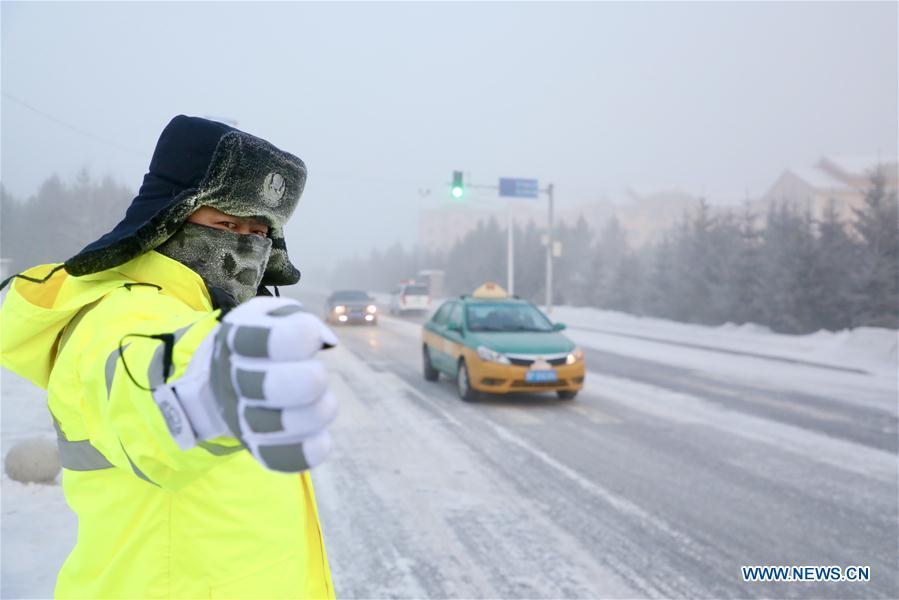 Mohe traffic police officers work outdoors in extremely cold weather